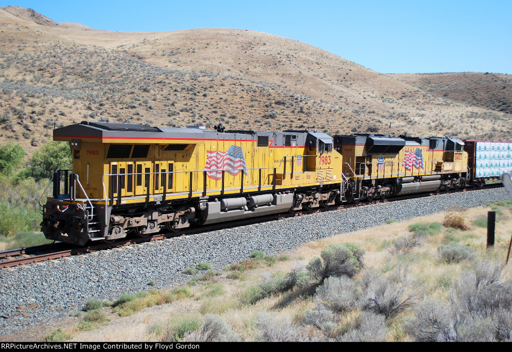 UP 7983 DPU on rear of eastbound freight